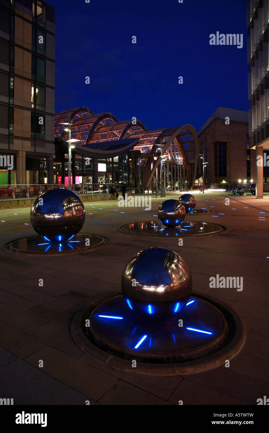 Polished chromed spheres water feature at night outside the Winter ...