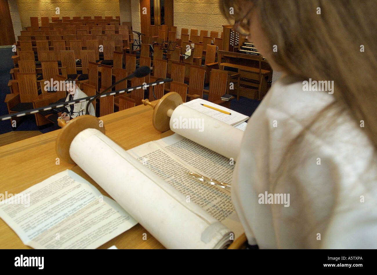 13 year old girl reading passage from the the scriptures during her bat ...