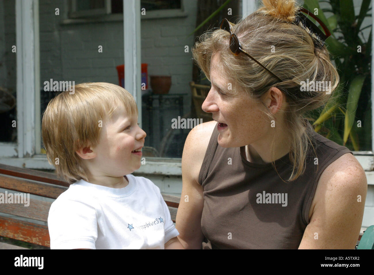 mother speaking to her 2 year old son Stock Photo - Alamy