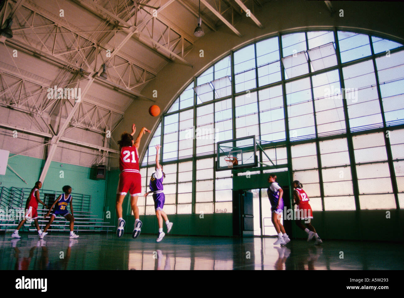 Woman playing basketball in gym hi-res stock photography and images - Alamy