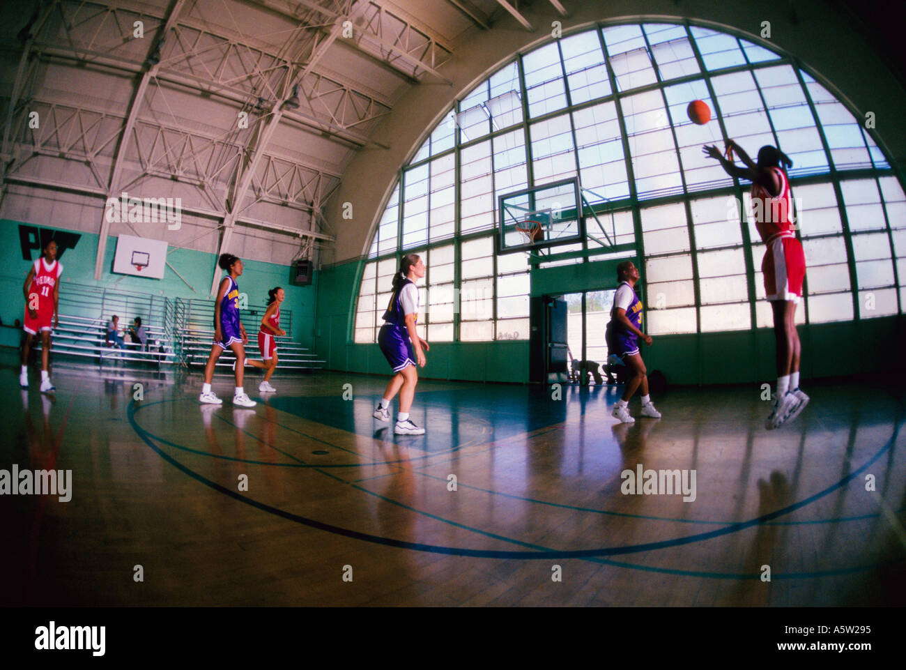 women playing basketball in a gym Stock Photo - Alamy