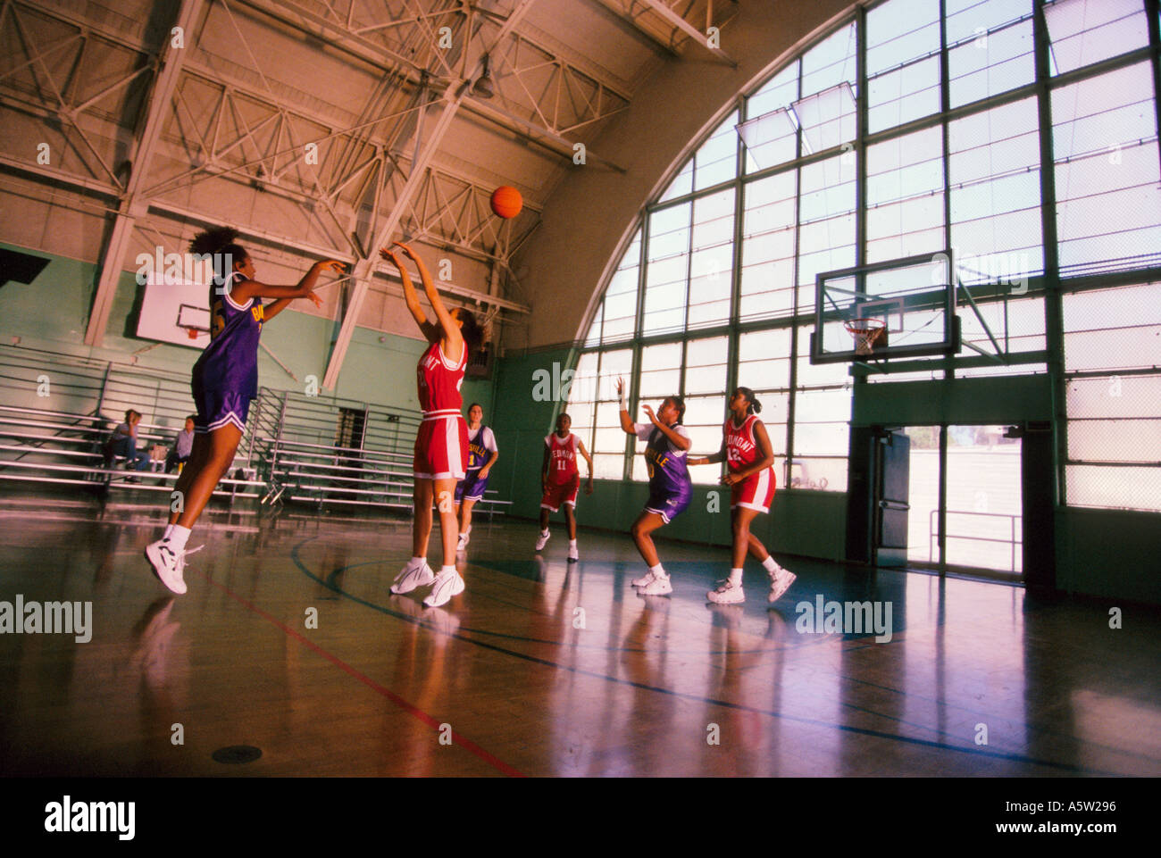 Girls playing basketball in gym hi-res stock photography and images - Alamy