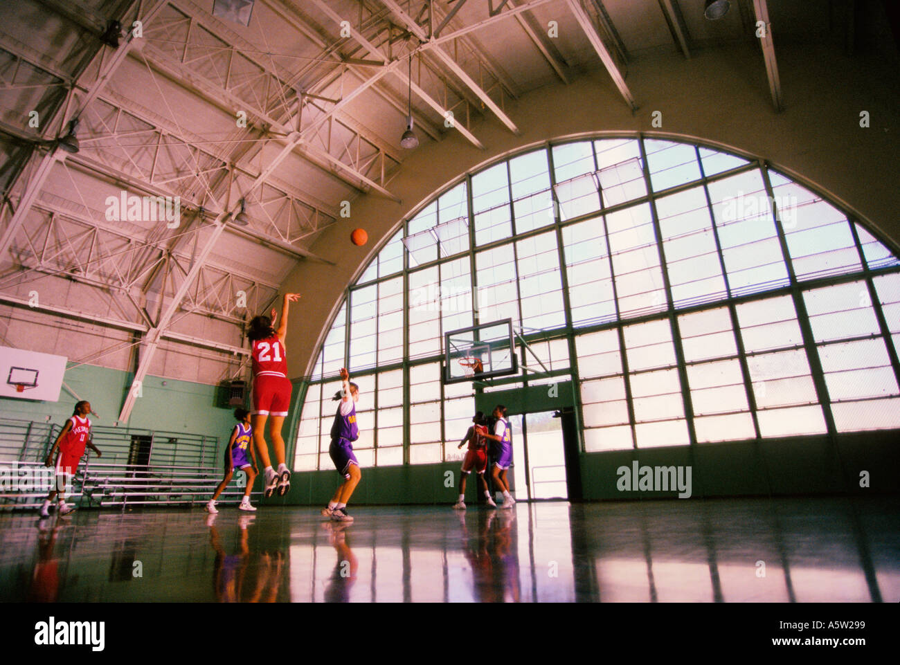 women playing basketball in a gym Stock Photo - Alamy