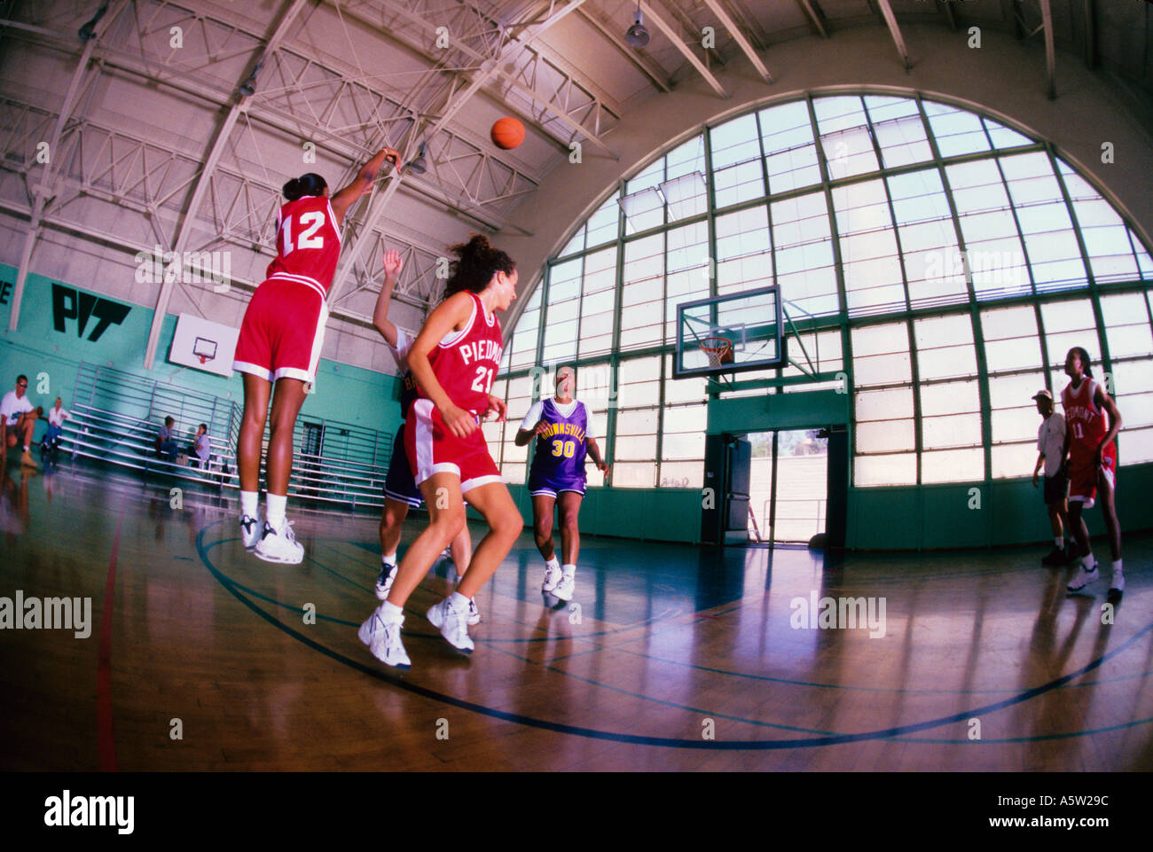 women playing basketball in a gym Stock Photo - Alamy