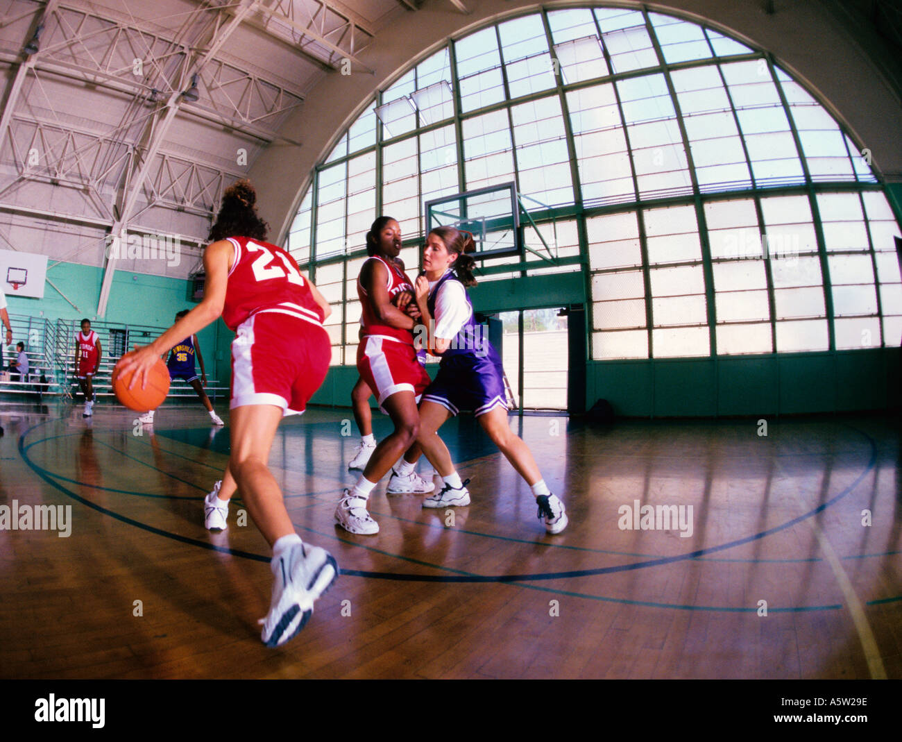 women playing basketball in a gym Stock Photo - Alamy