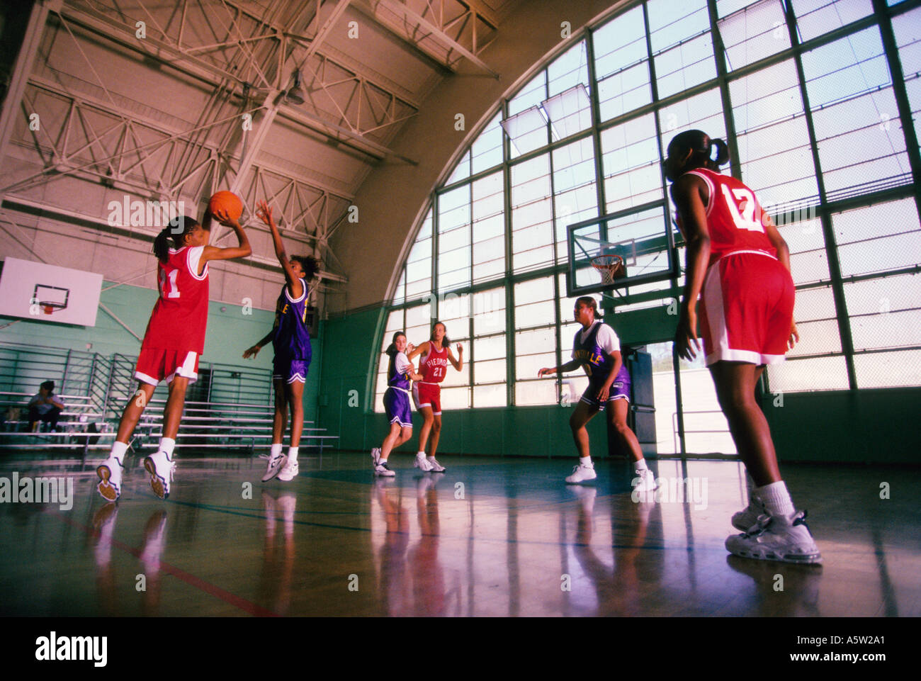 women playing basketball in a gym Stock Photo - Alamy