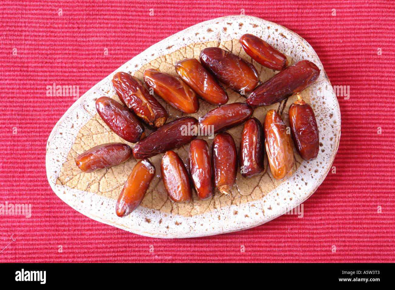 Dried dates on the leaflike tray Stock Photo - Alamy