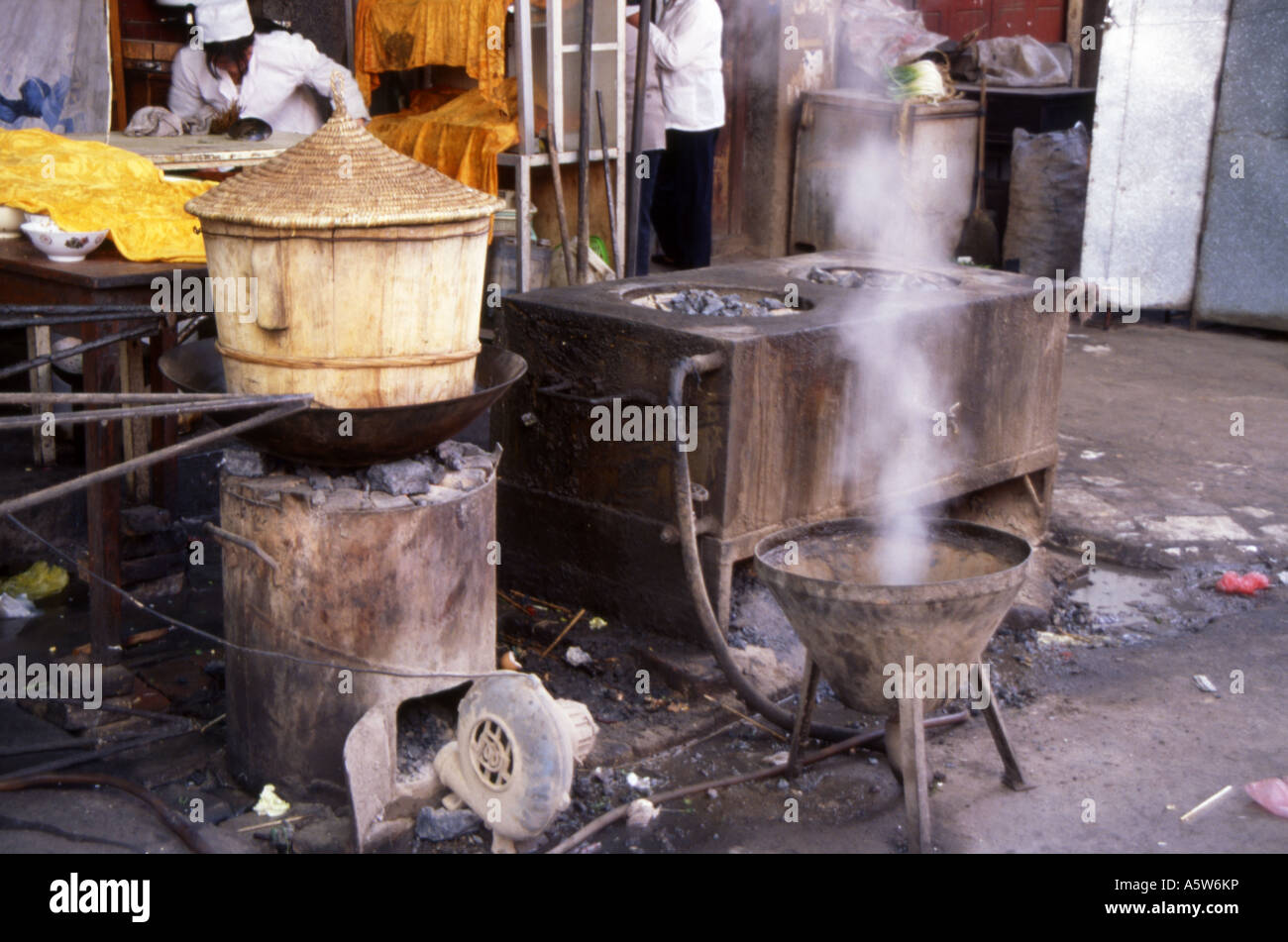 On traditional solid fuel burner at the roadside in chengdu hi-res ...