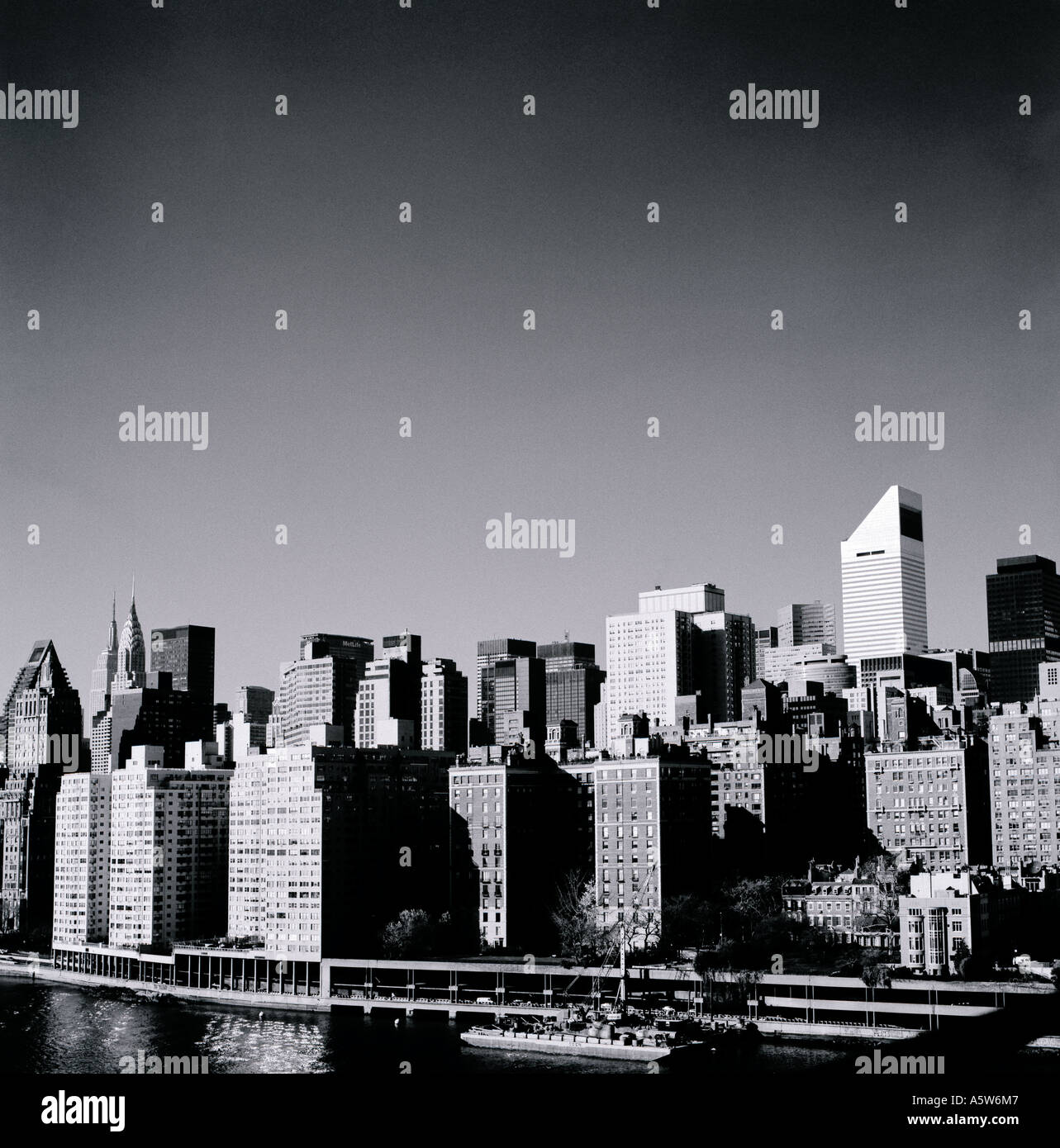 Stark Manhattan New York City scene overlooking the East River in New ...
