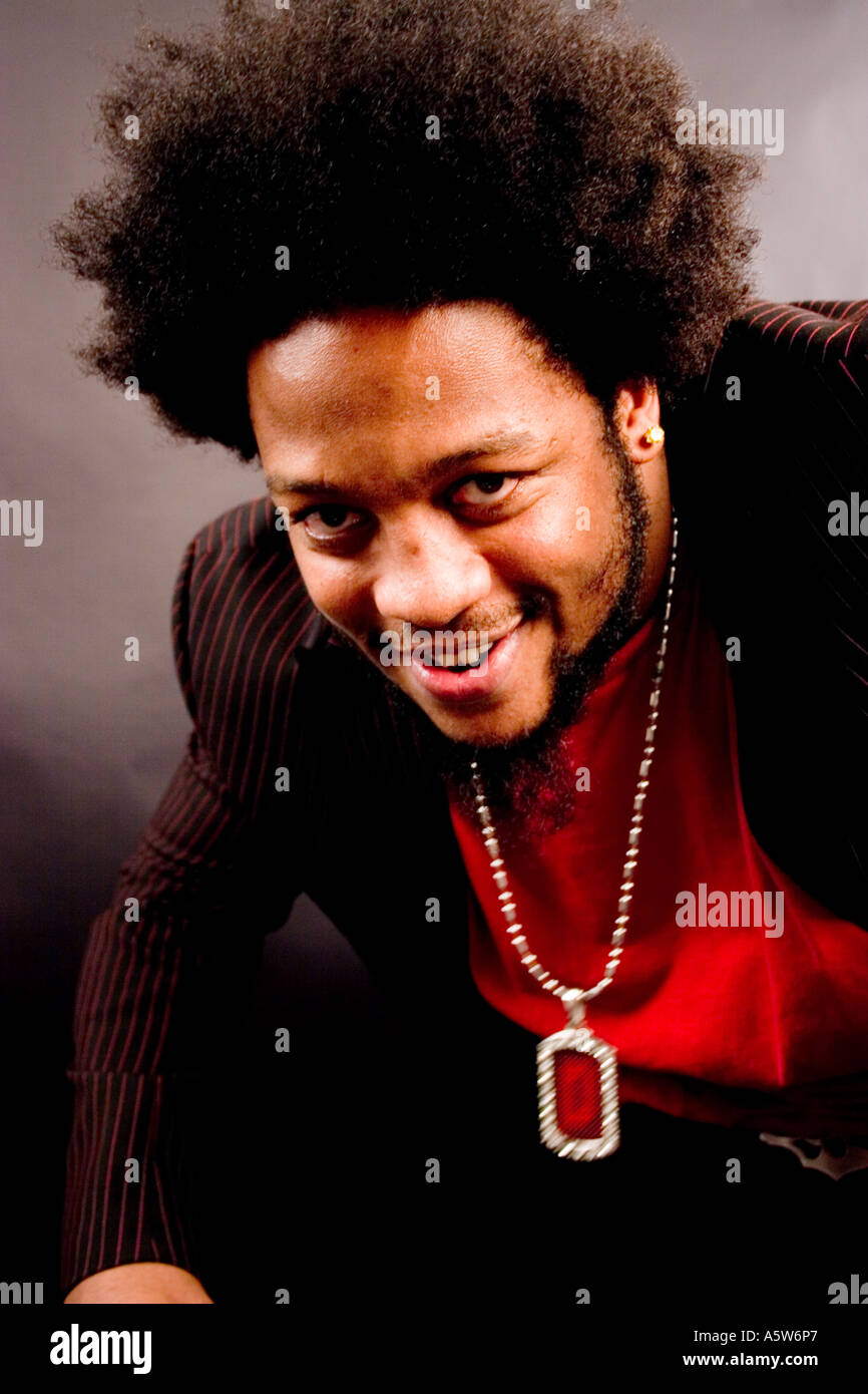 Happy black man with giant afro hair Stock Photo - Alamy