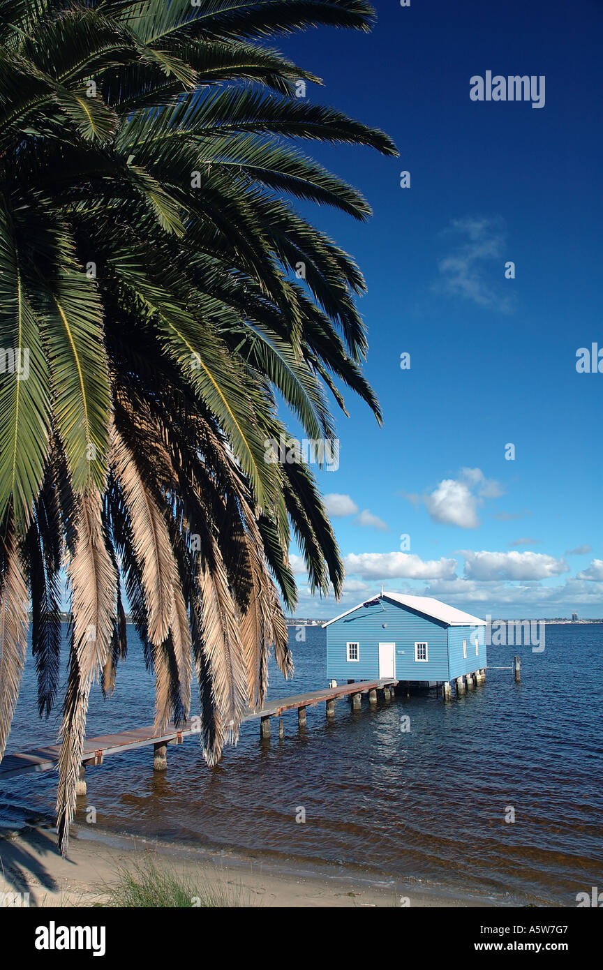 Blue boat shed on river with date palm Stock Photo - Alamy
