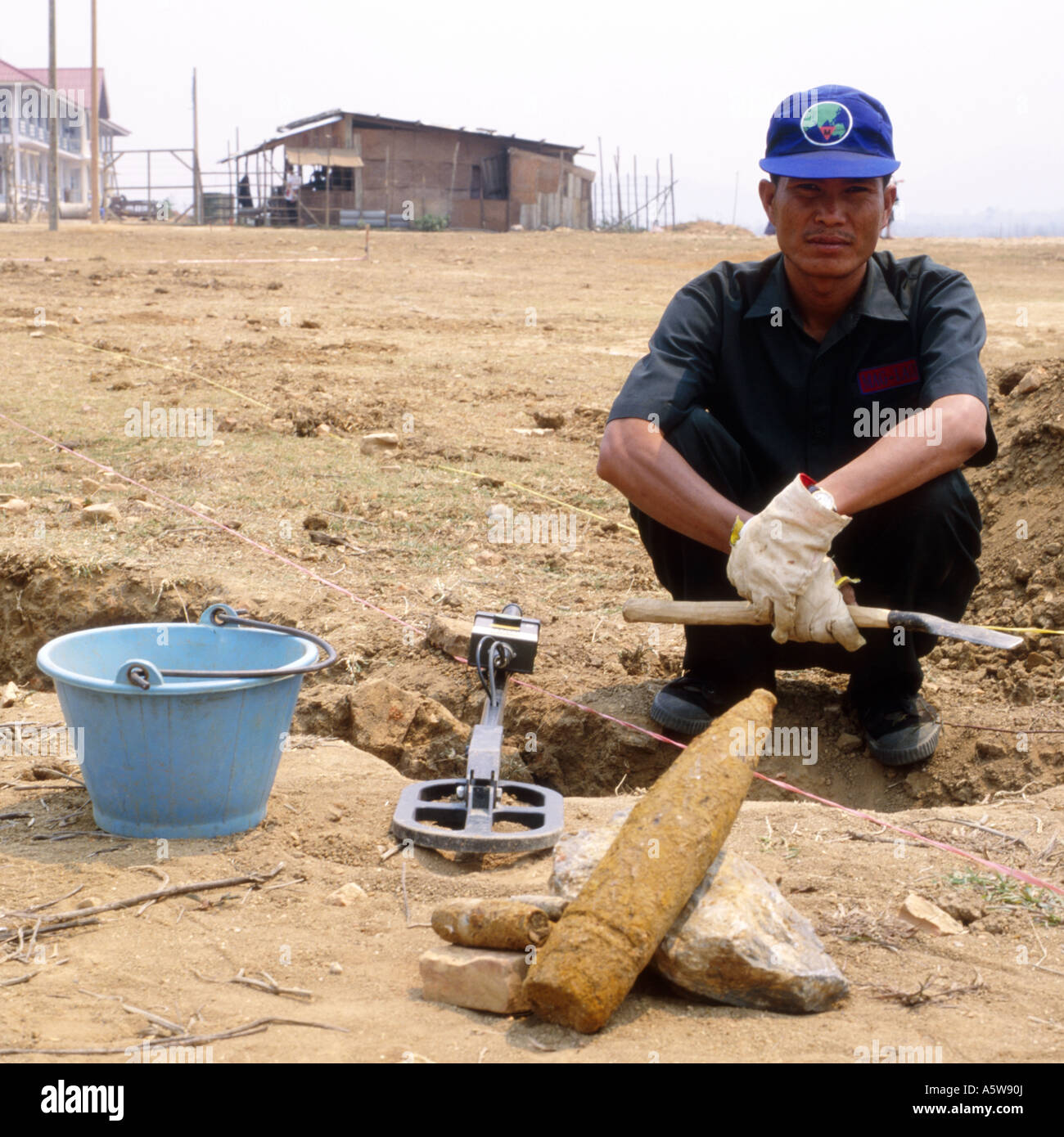 Local man,trained by Mine Action Group,working on excavated unexploded ...