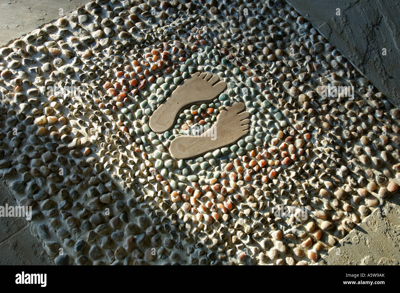The owner of a building traditionally places his footprints to indicate ...