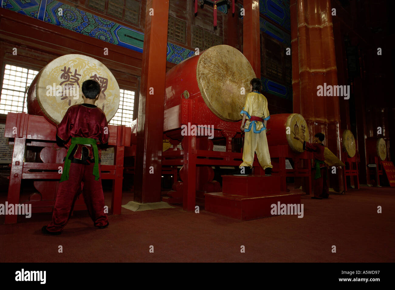 China, Beijing - Three Chinese drummers performing inside The Beijing ...