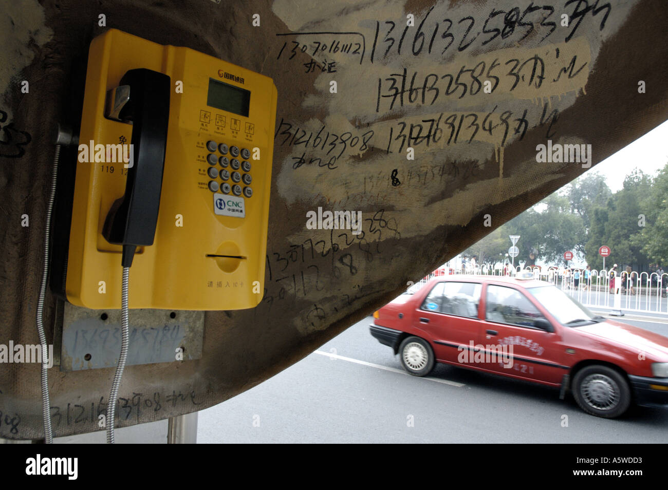 China Beijing Public Yellow Telephone And A Speeding Red Taxi Stock ...