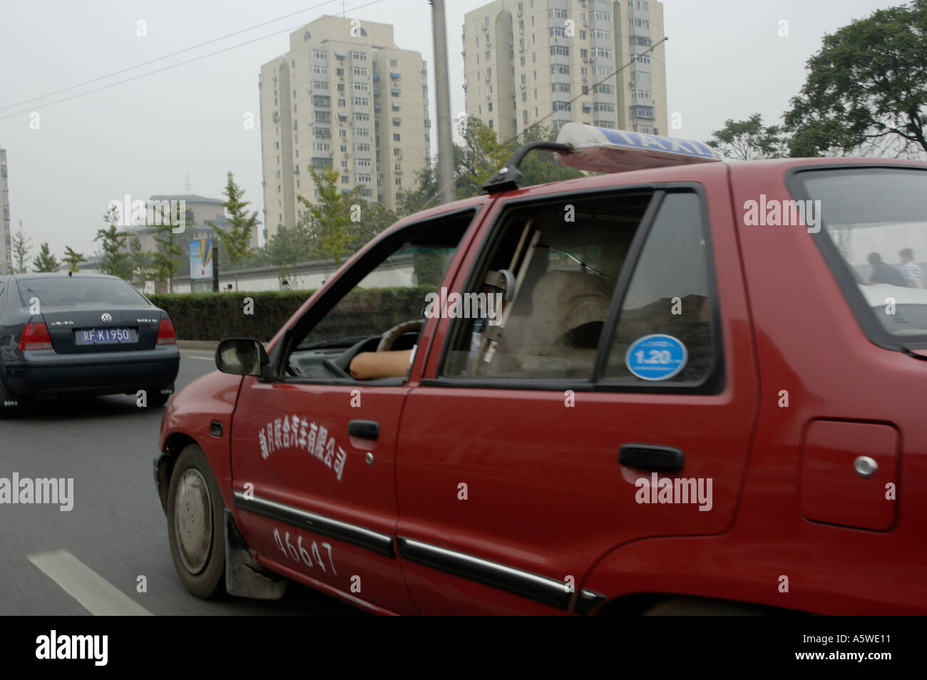 China Beijing A Red Taxi Inside A Traffic Jam Downtown Stock Photo - Alamy