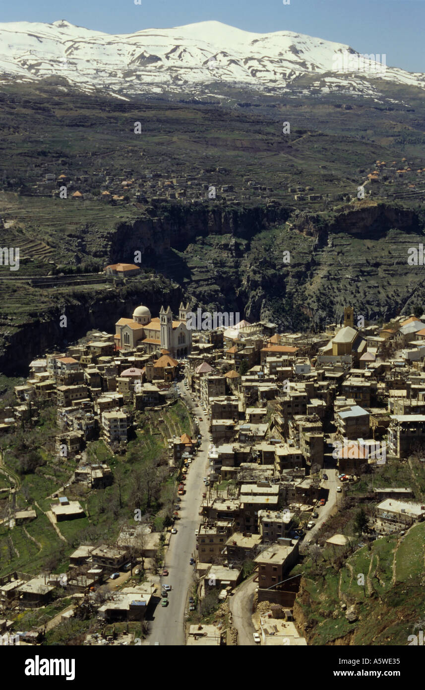 Bsharri village with view of snowcapped Lebanese Mountains, Lebanon ...