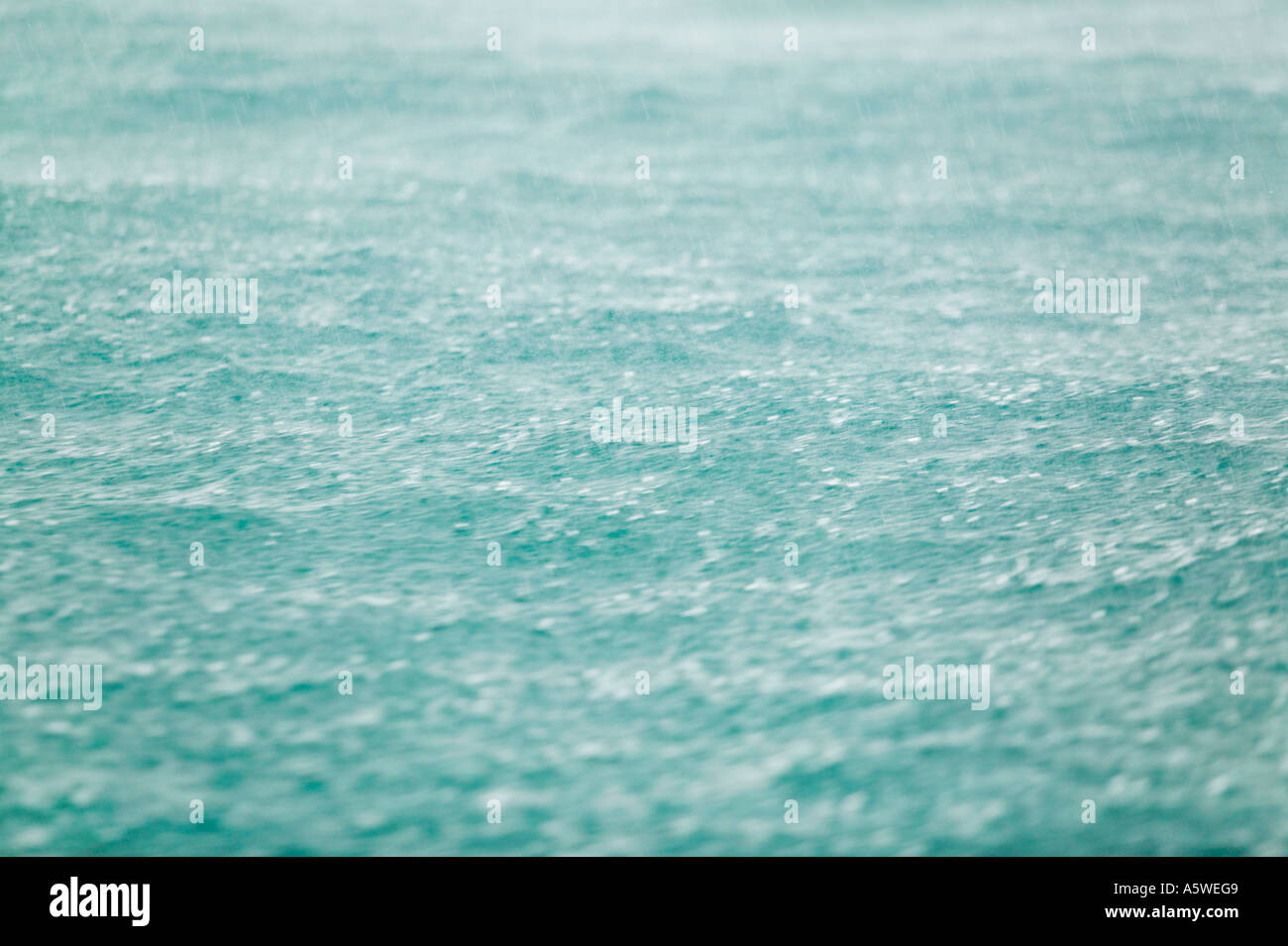 Rain falling on water Thailand Stock Photo - Alamy