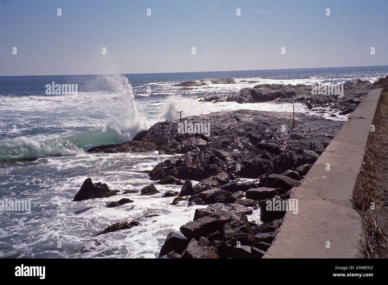 Waves strike rocks along Cliff Walk in Newport, RI Stock Photo - Alamy