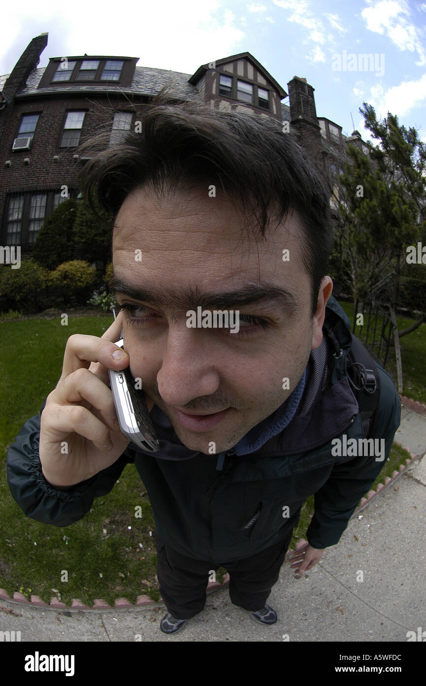 Young Spanish man MR talking with his cel phone New York City latino ...
