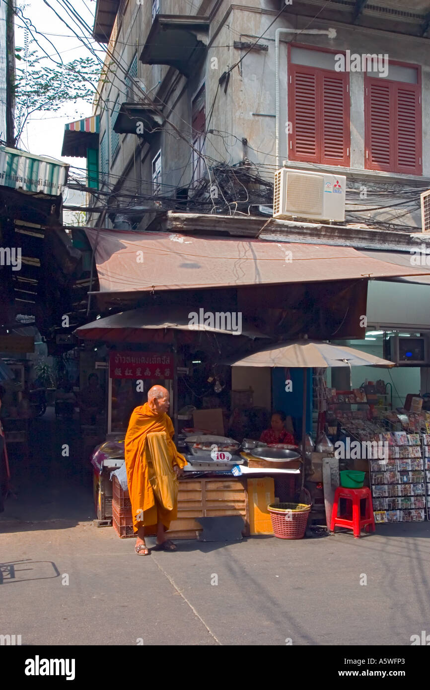 Monk leaving street stall Bangkok Thailand Stock Photo - Alamy