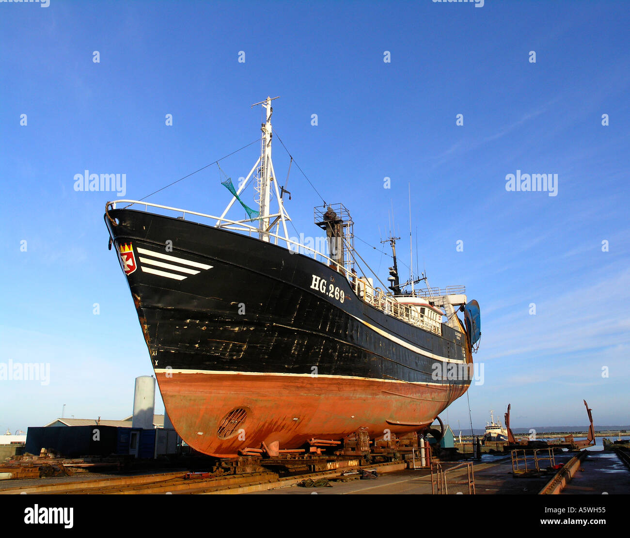 Big modern industrial fishing trawler in for maintenance in ship yard ...