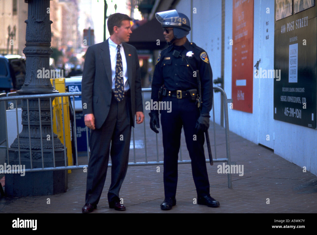 Adults talking policeman hi-res stock photography and images - Alamy