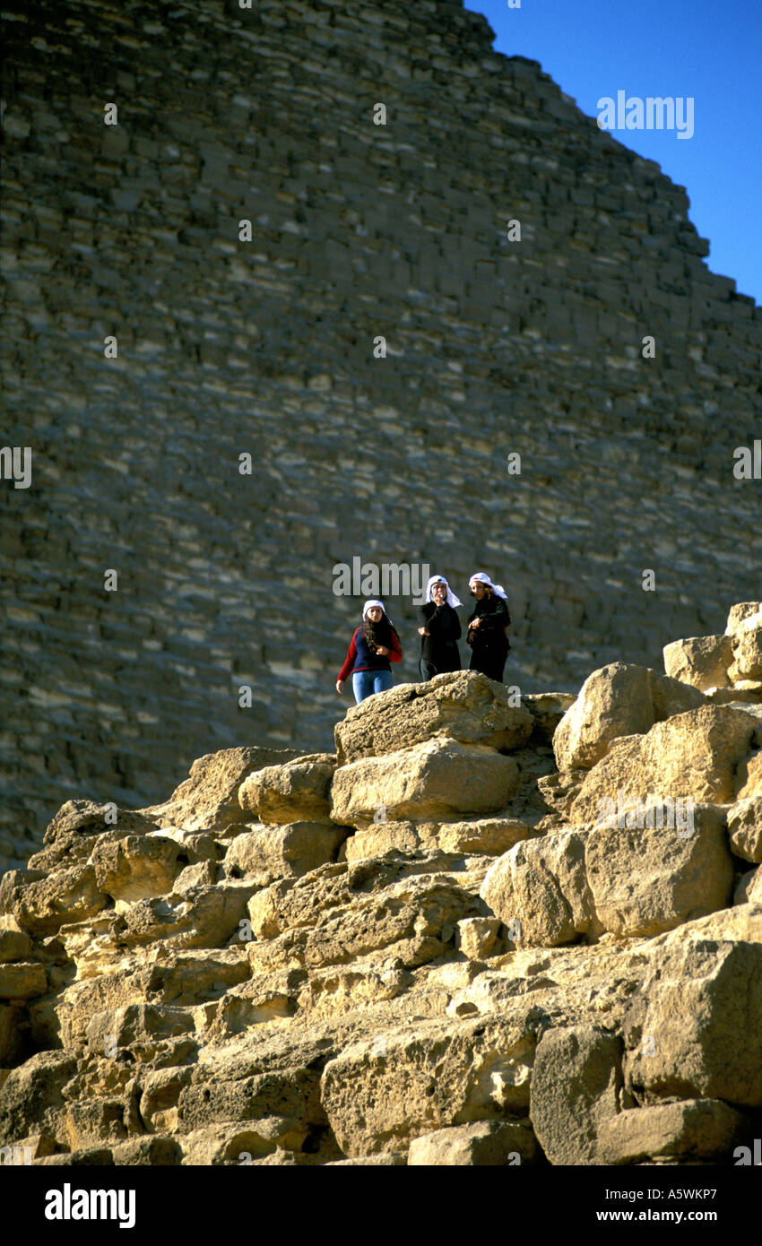 Three Egyptian women tourists visiting the Pyramids of Giza Stock Photo ...