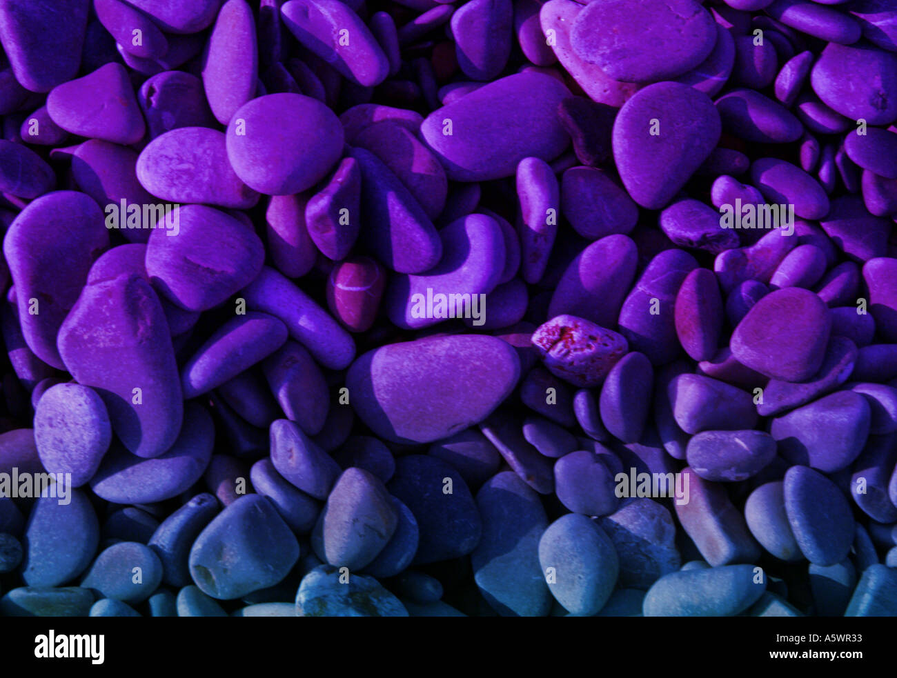 colour enhanced image of pebbles on a beach Stock Photo - Alamy