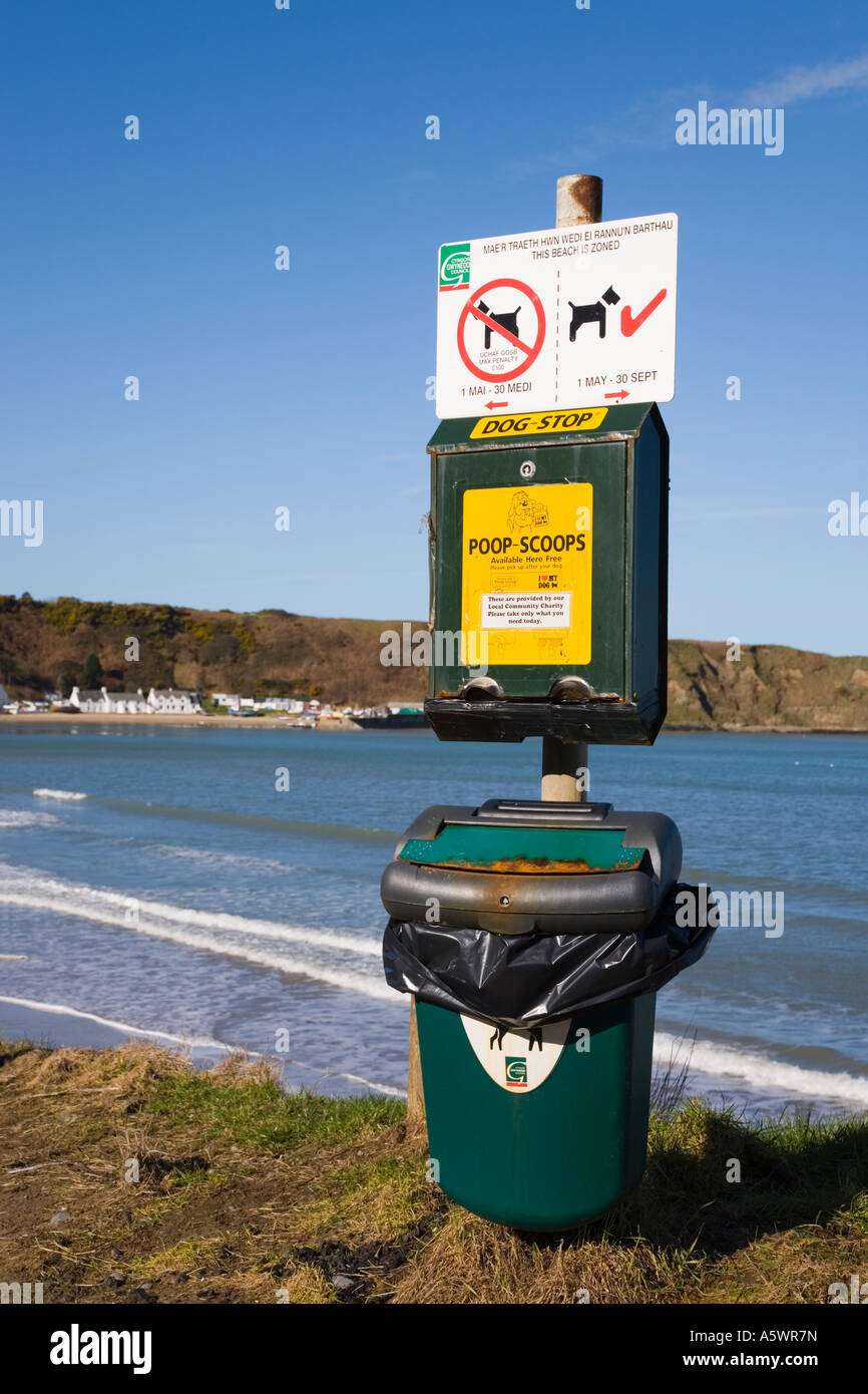 Poop scoops dog waste bin by beach with dog zone signs Morfa Nefyn ...
