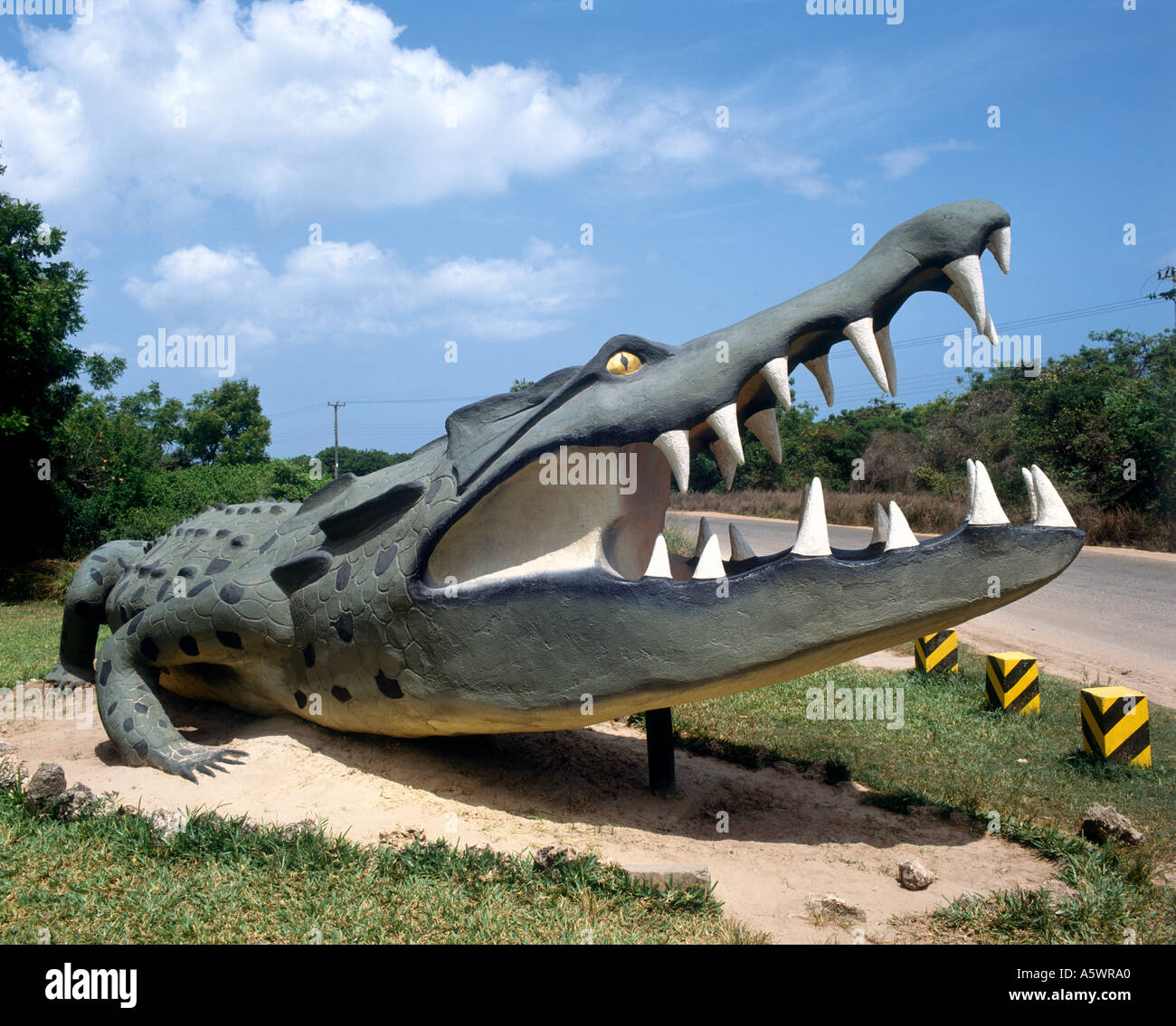Giant stone crocodile at the entrance to Mamba Crocodile Village, Nyali ...