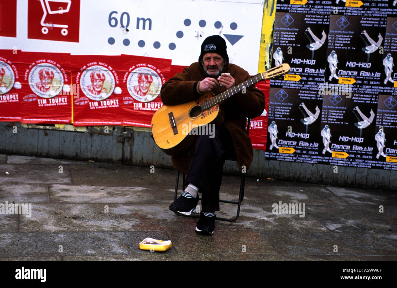Homeless man busking hi-res stock photography and images - Alamy
