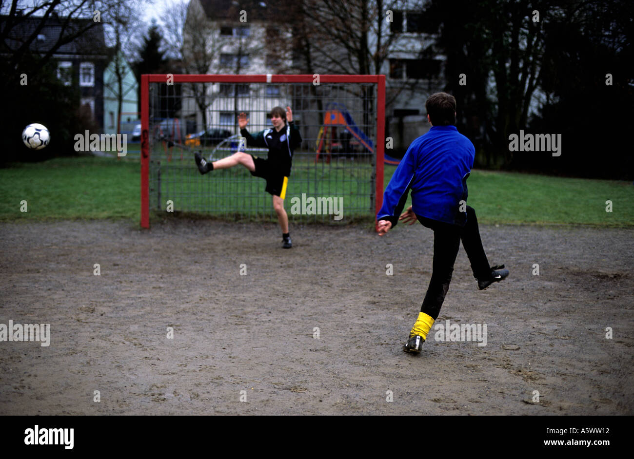 Boys playing football after school in Solingen, North Rhine Westphalia ...