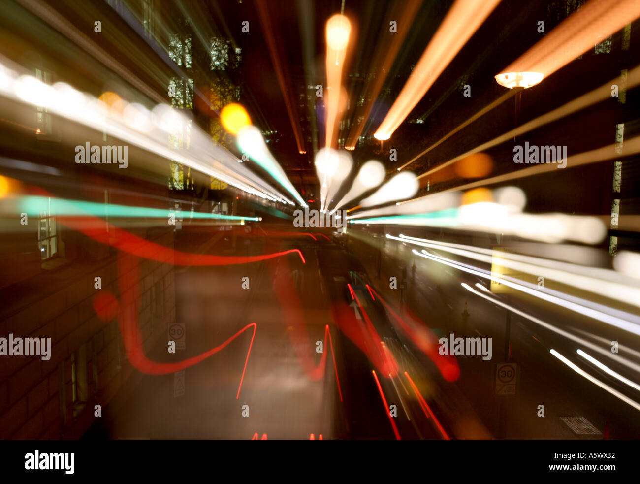 camera effect to make rays of light from traffic in a street in london ...