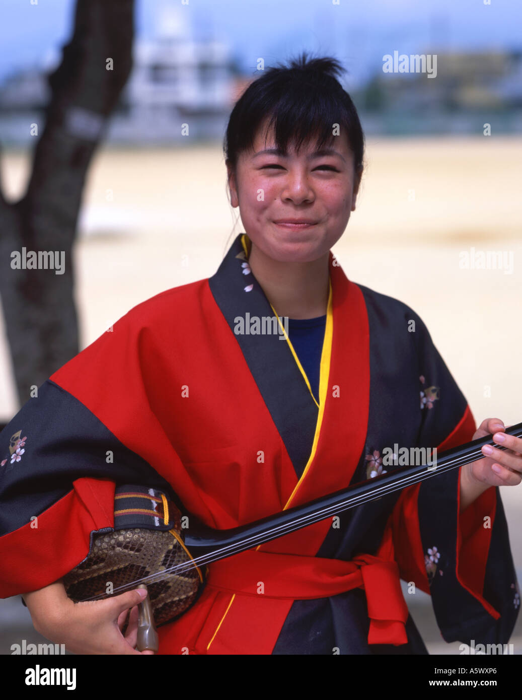 Okinawan girl with sanshin a traditional Okinawan three-stringed ...