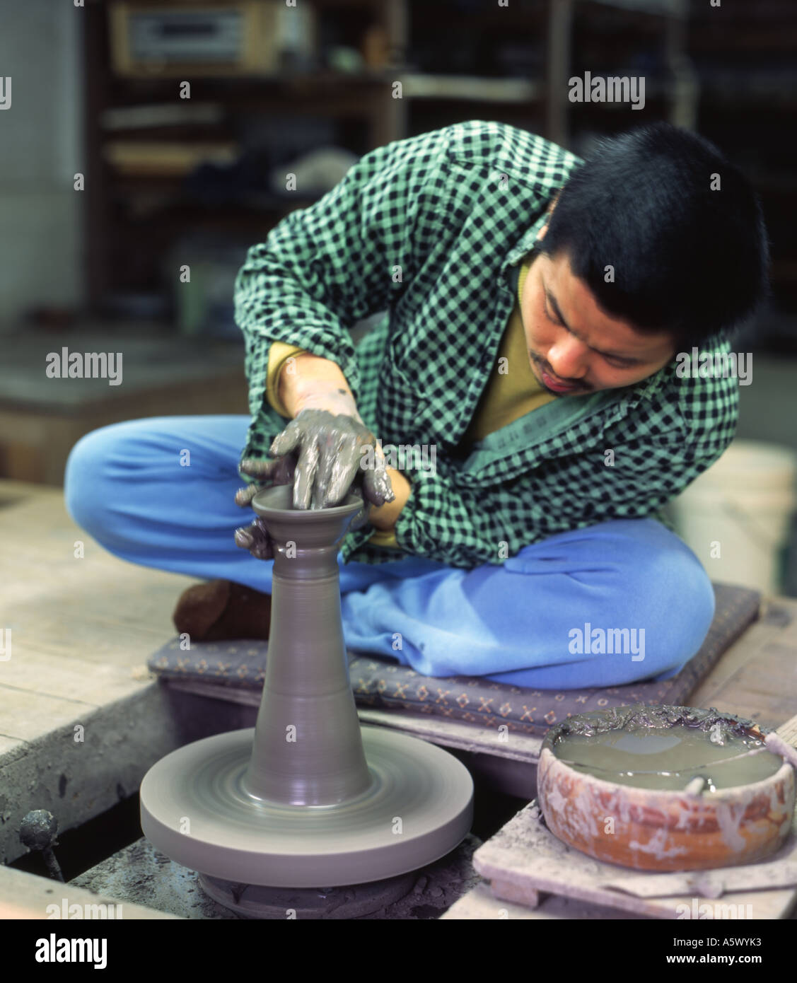 Potter creating bizen-yaki Japan's oldest pottery style. It is usually ...