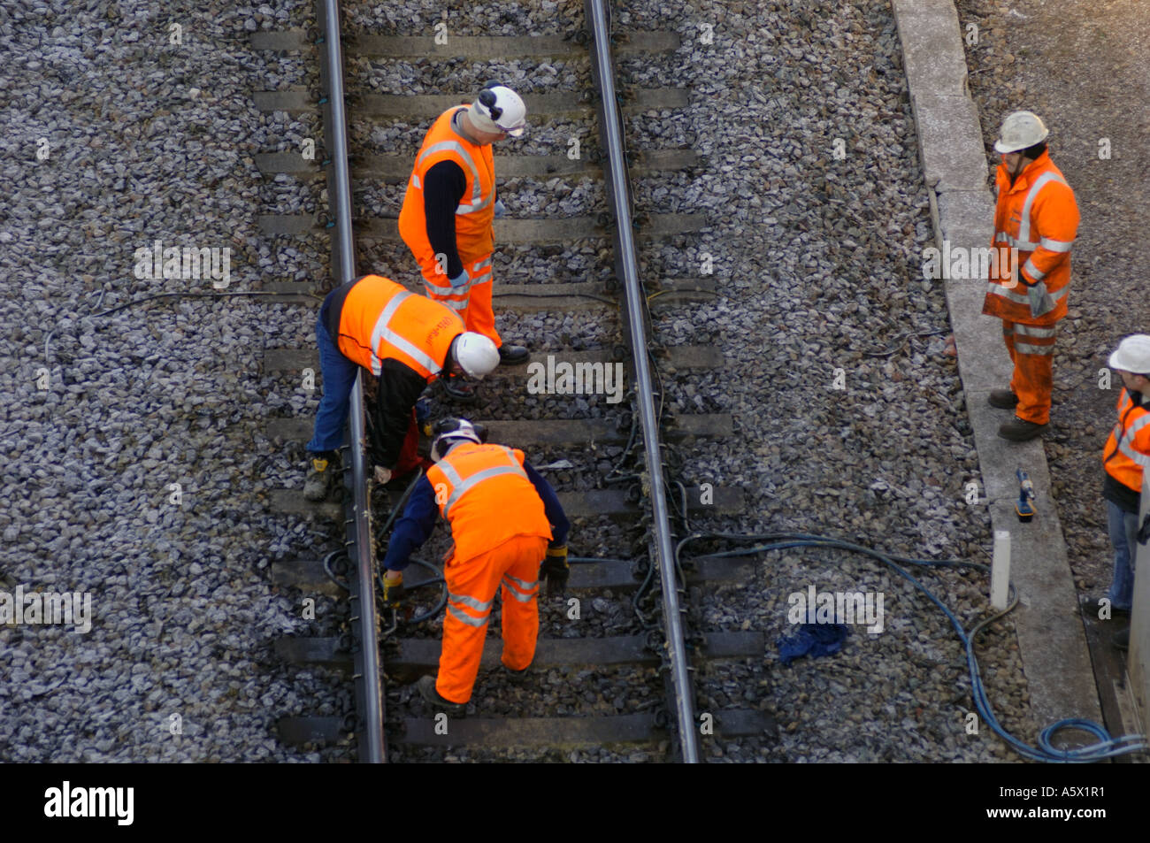 Railway workers maintaining track Stock Photo - Alamy