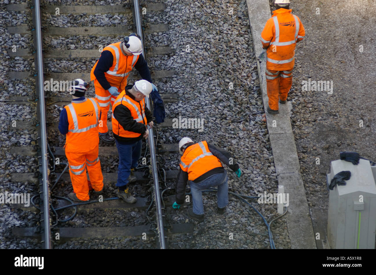 Railway workers maintaining track Stock Photo - Alamy