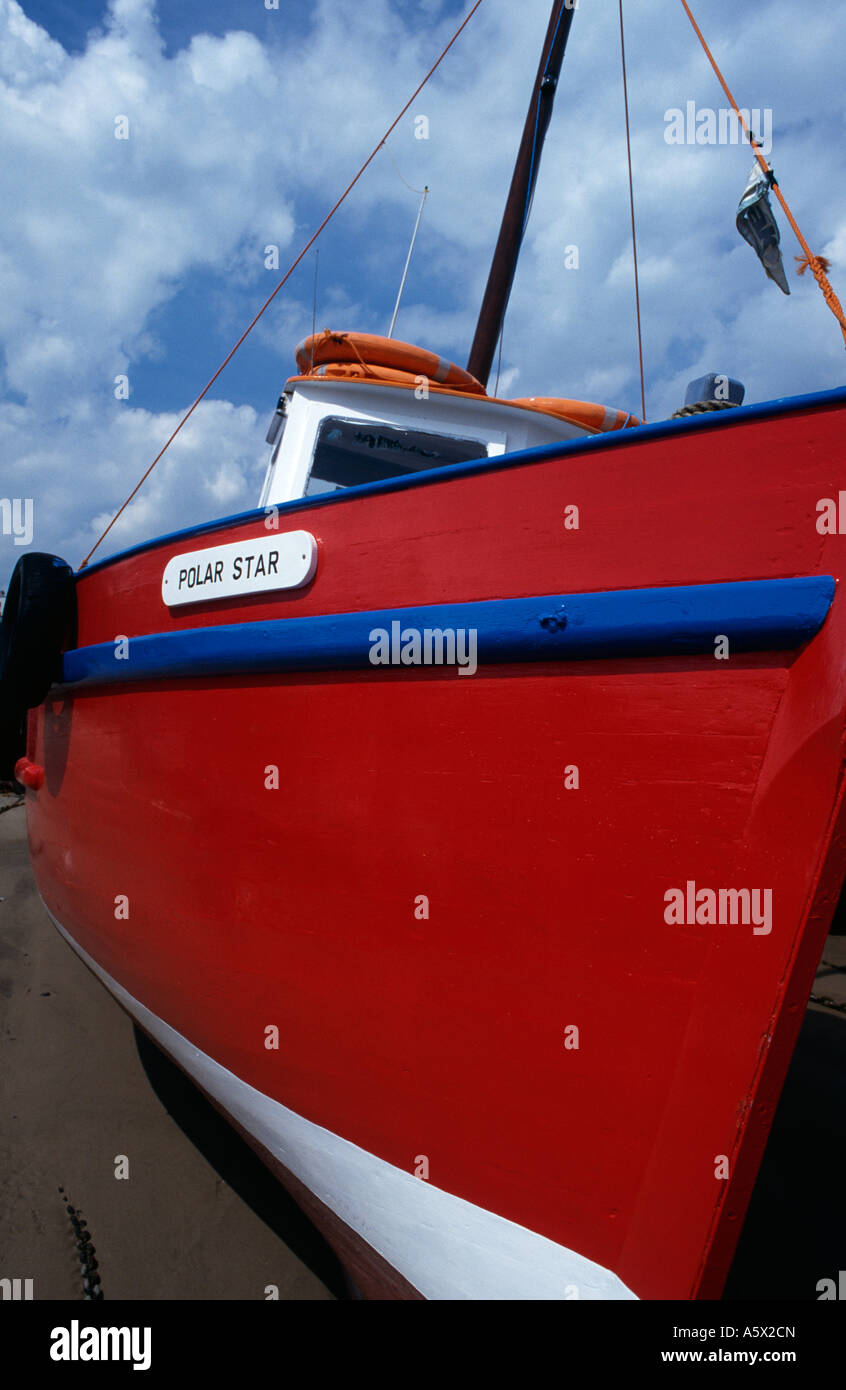 Brightly painted red fishing boat Tenby Pembrokeshire Wales UK Stock ...