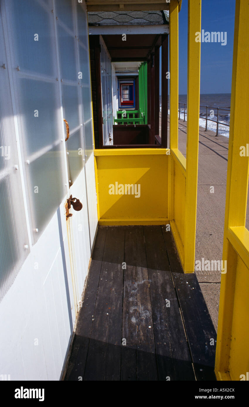 View through windows of colourful beach huts Southwold Suffolk England ...