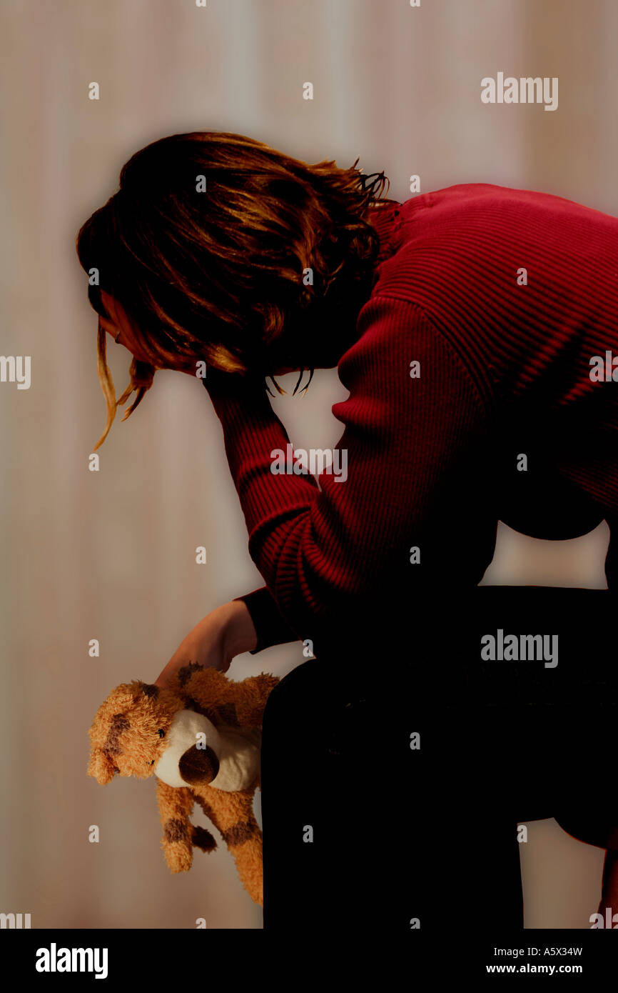 Desperation / bereavement - silhouette of woman Stock Photo - Alamy
