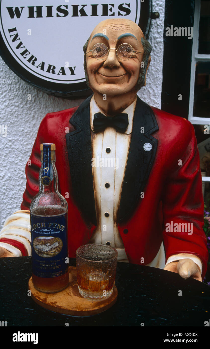 Figure with Loch Fyne Whiskey Bottle and Glass outside a Pub, Inveraray ...