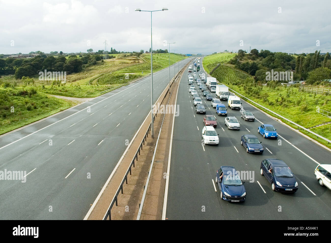 Traffic queue on the M60 motorway near Ashton under Lyne, Greater ...