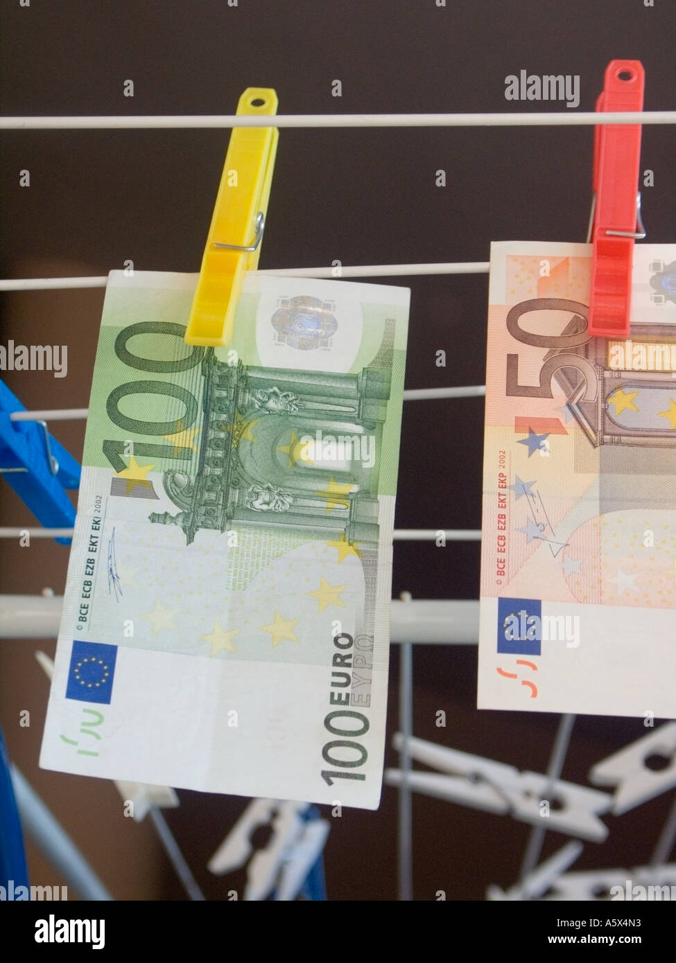 Washed money hanged on a rope drying Stock Photo - Alamy