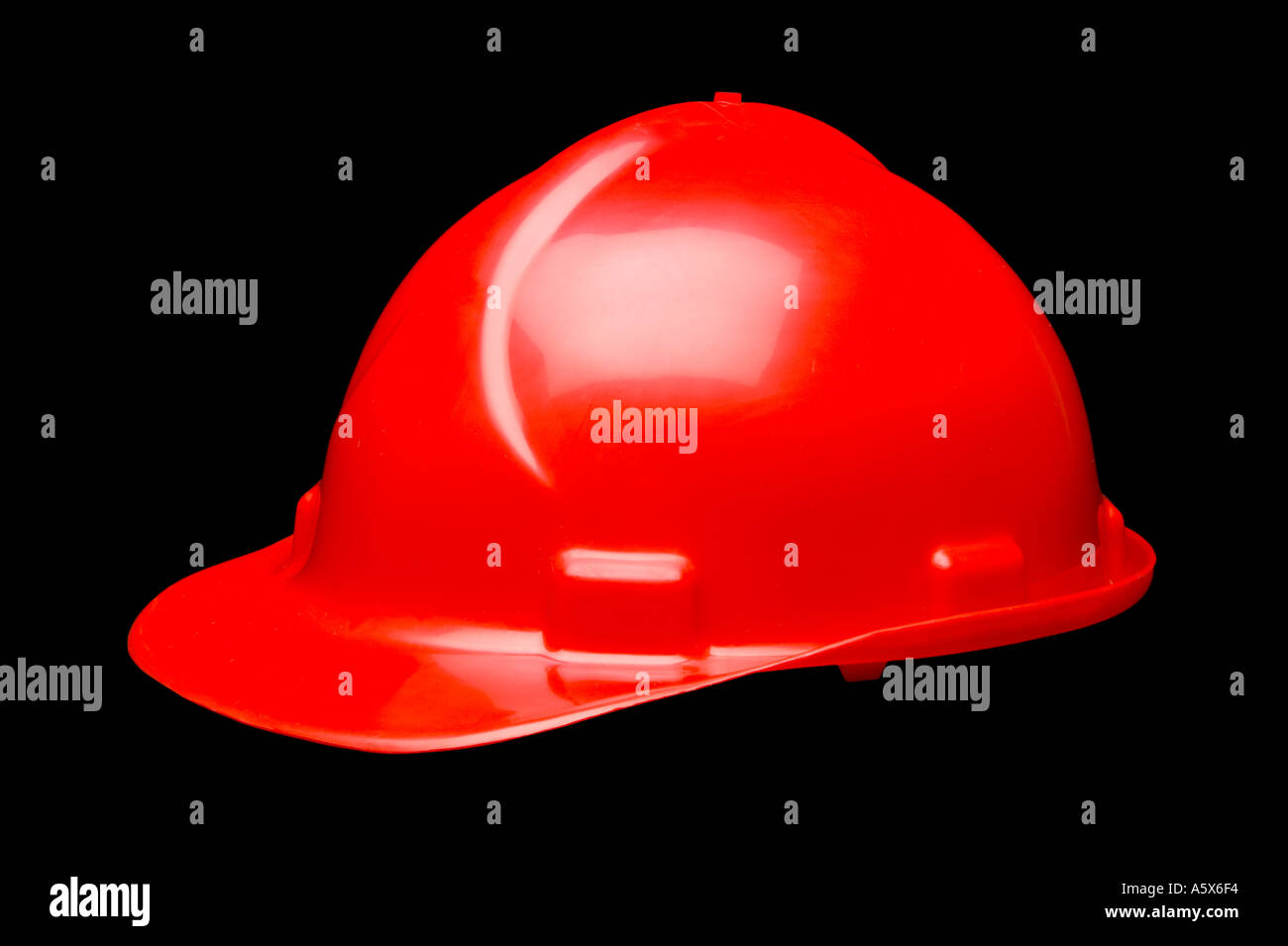 RED SAFETY HELMET HARD HAT ON BLACK BACKGROUND Stock Photo - Alamy
