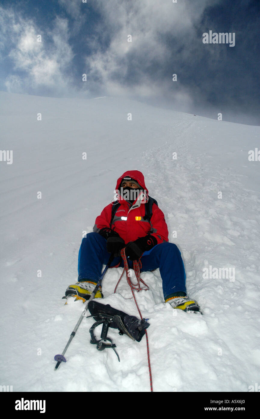 Tired climber on Cotopaxi, Cotopaxi Province, Ecuador, South America ...