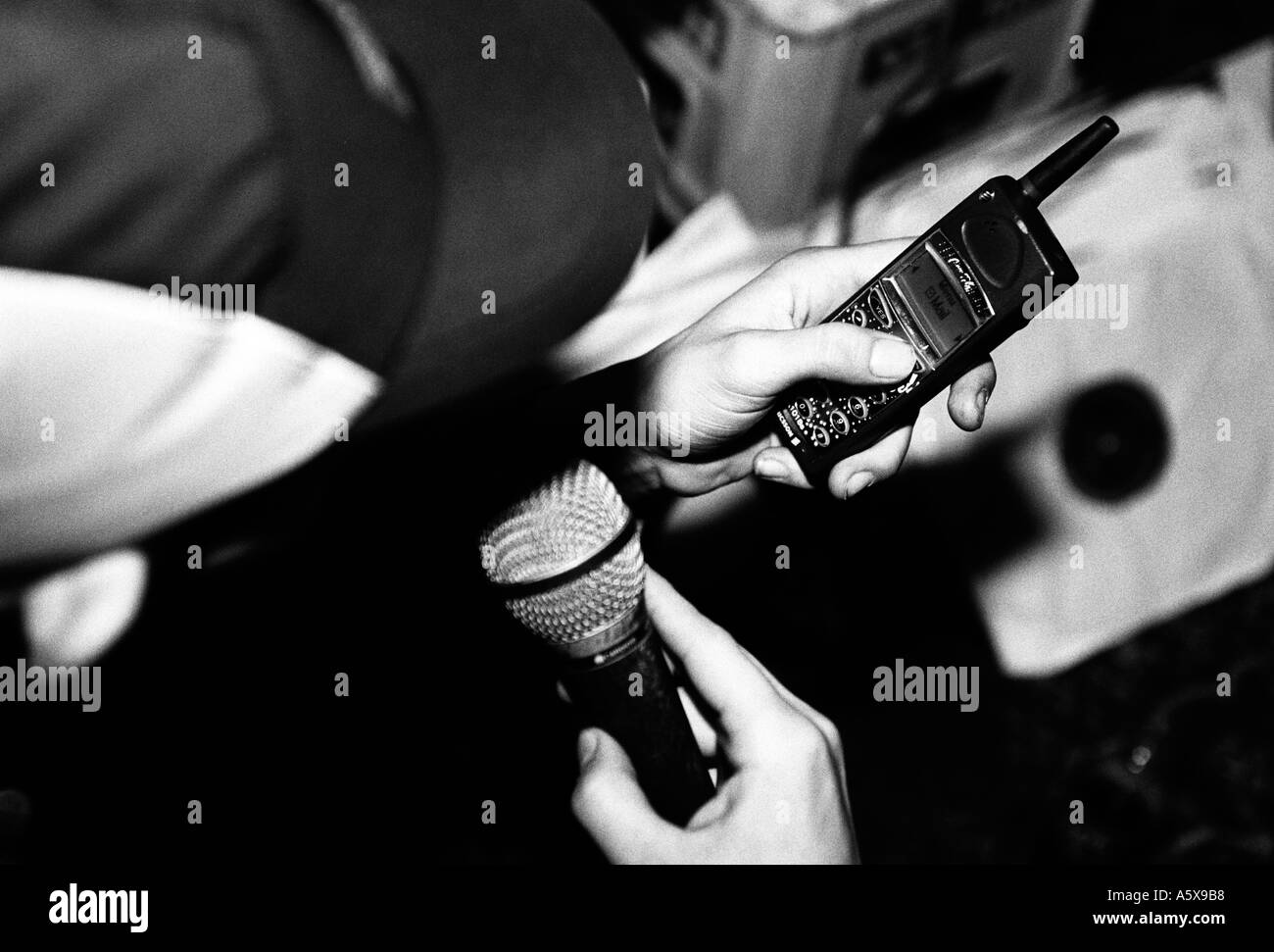 Pirate Radio DJ with mobile phone Stock Photo - Alamy