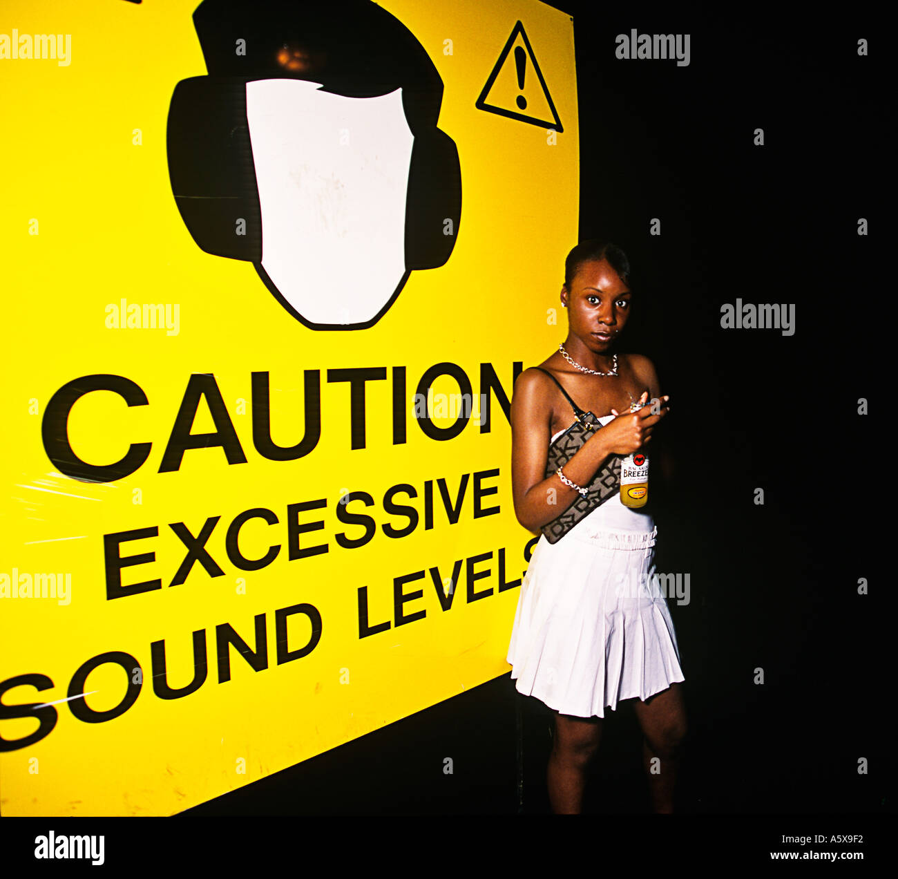 Woman against Caution sign at Smoove at Ministry of Sound Stock Photo ...