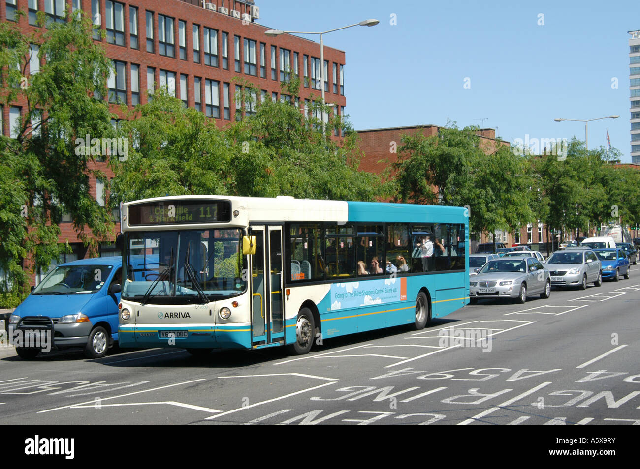 Arriva bus and cars queue in heavy traffic in a city centre in the uk ...