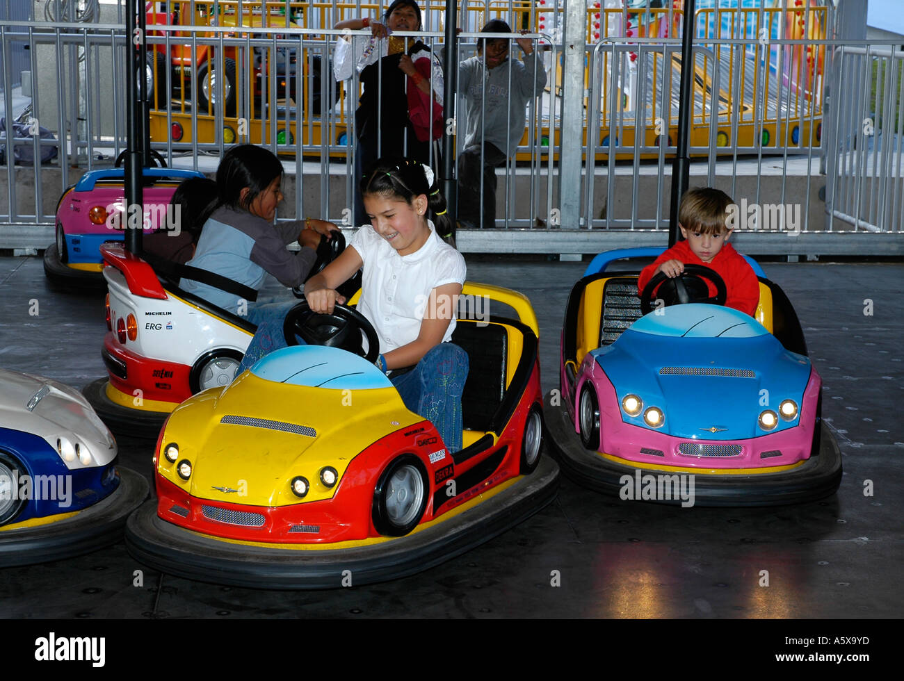 Children driving bumper cars hi-res stock photography and images - Alamy